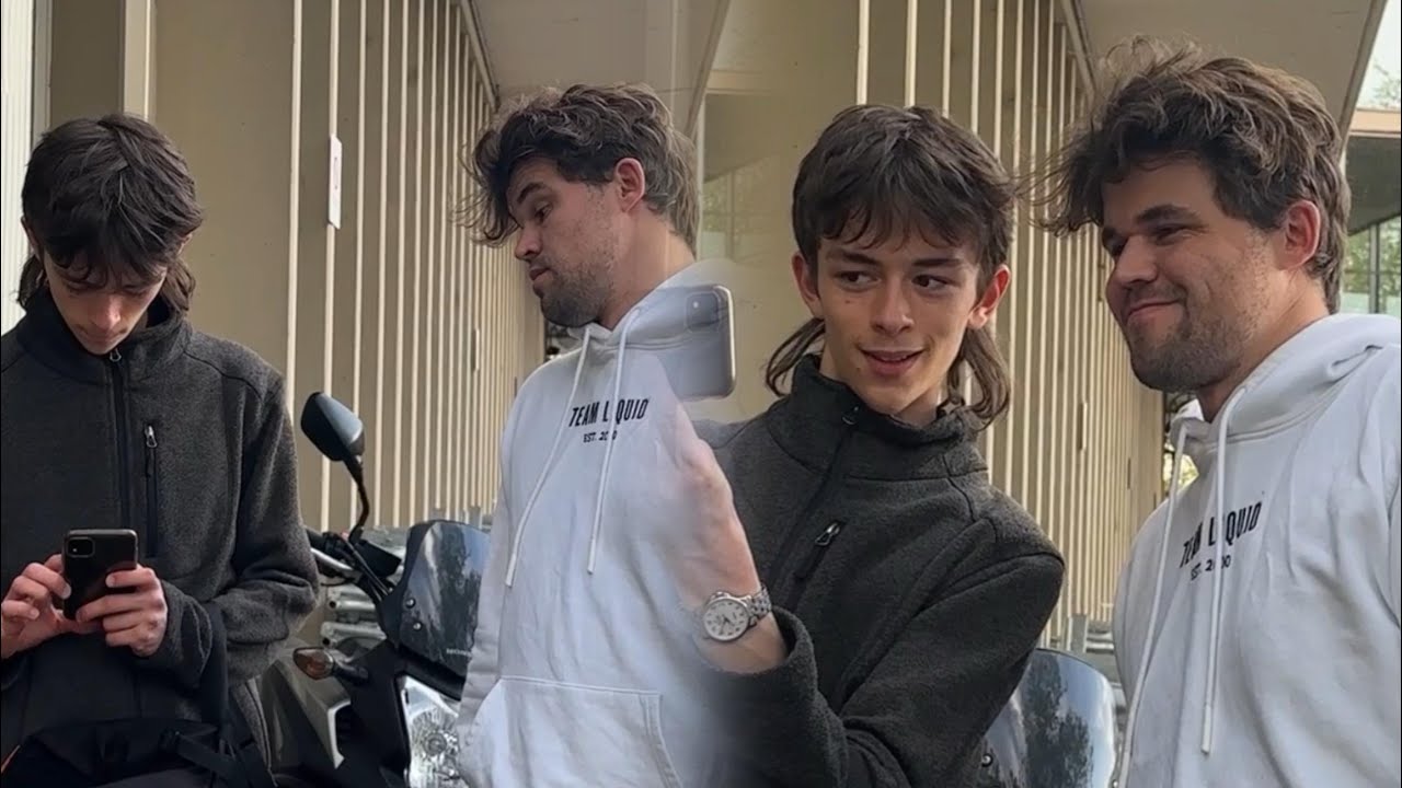 Fan’s camera gets stuck, Magnus Carlsen waits patiently to give a selfie